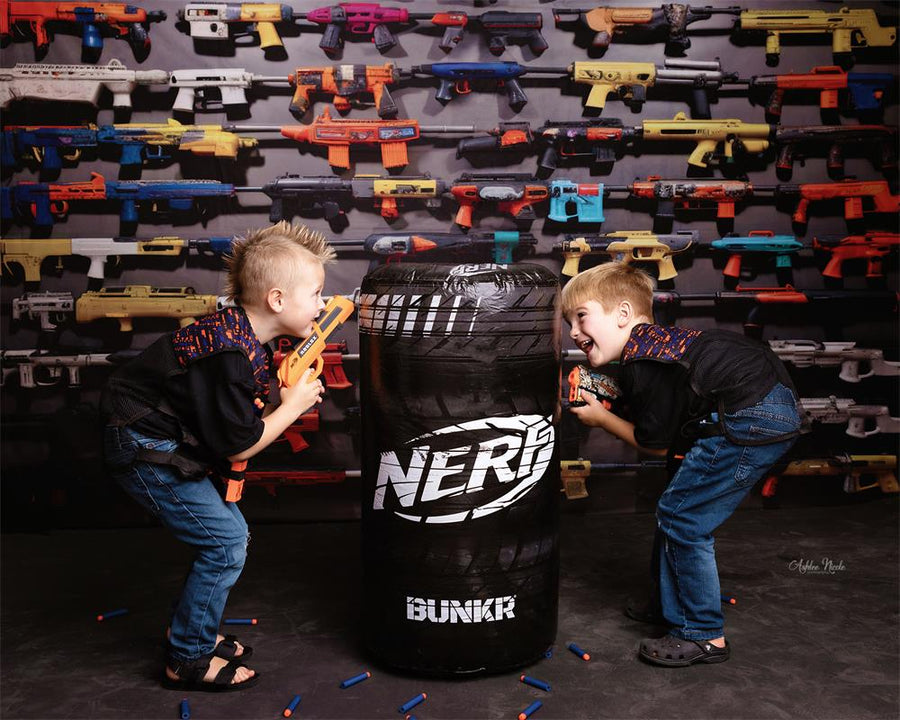 Home Kate Colorful Toy Gun Display Wall Backdrop Designed by Lidia Redekopp